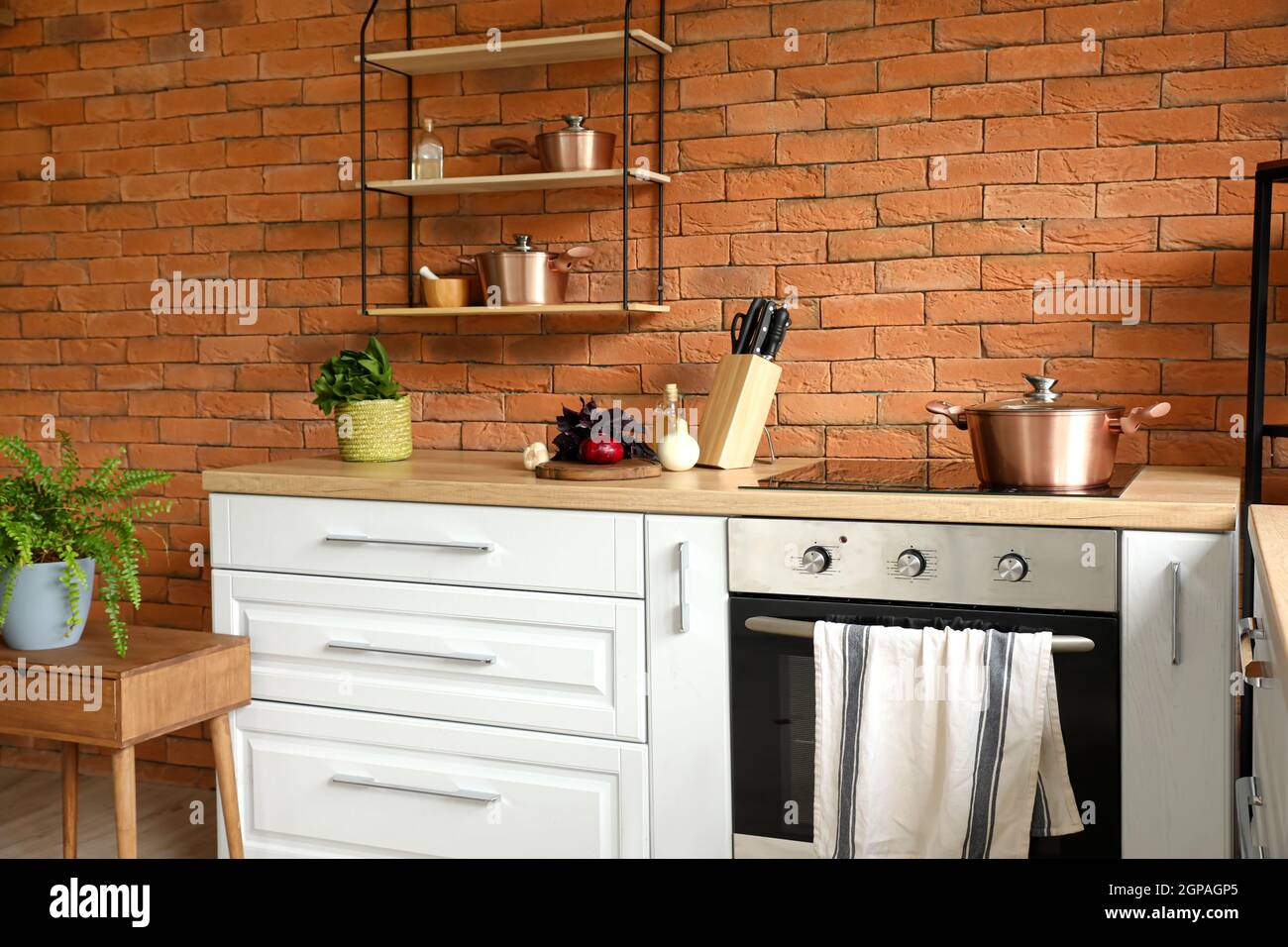 Interior of stylish kitchen with modern cookware Stock Photo - Alamy