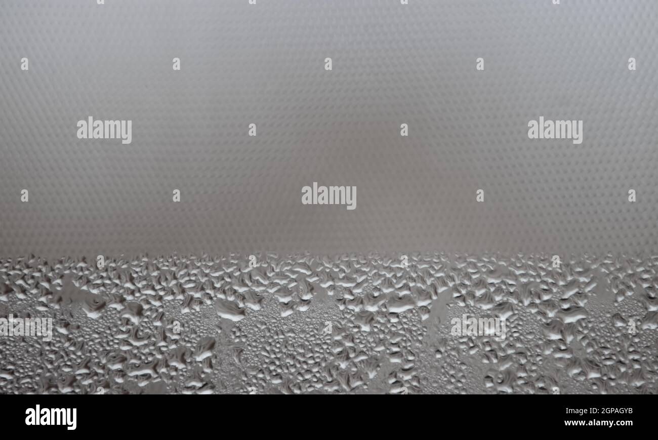 Evaporation of moisture on frosted glass indoors Stock Photo - Alamy