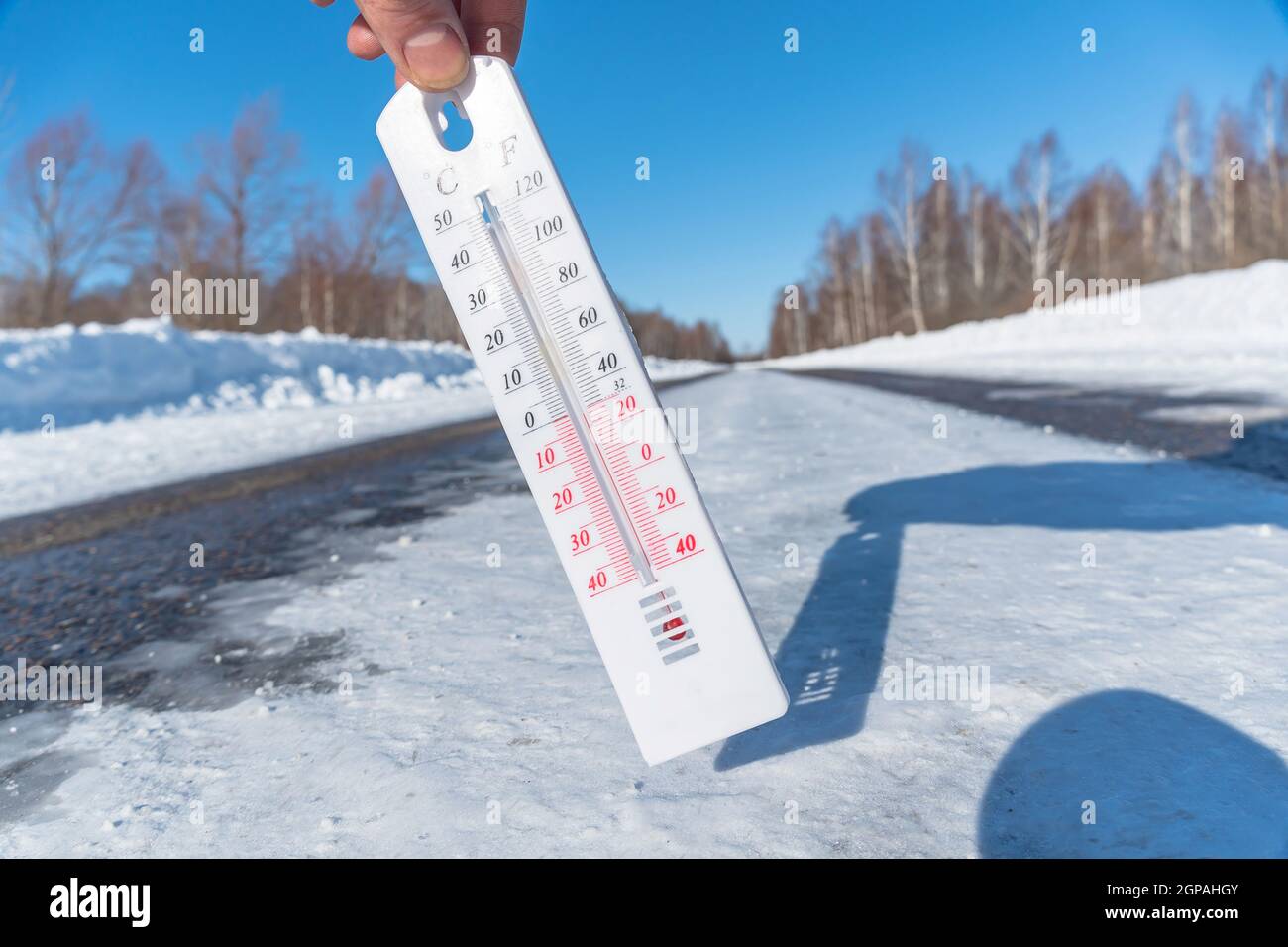 The thermometer shows a negative temperature in cold weather against ...