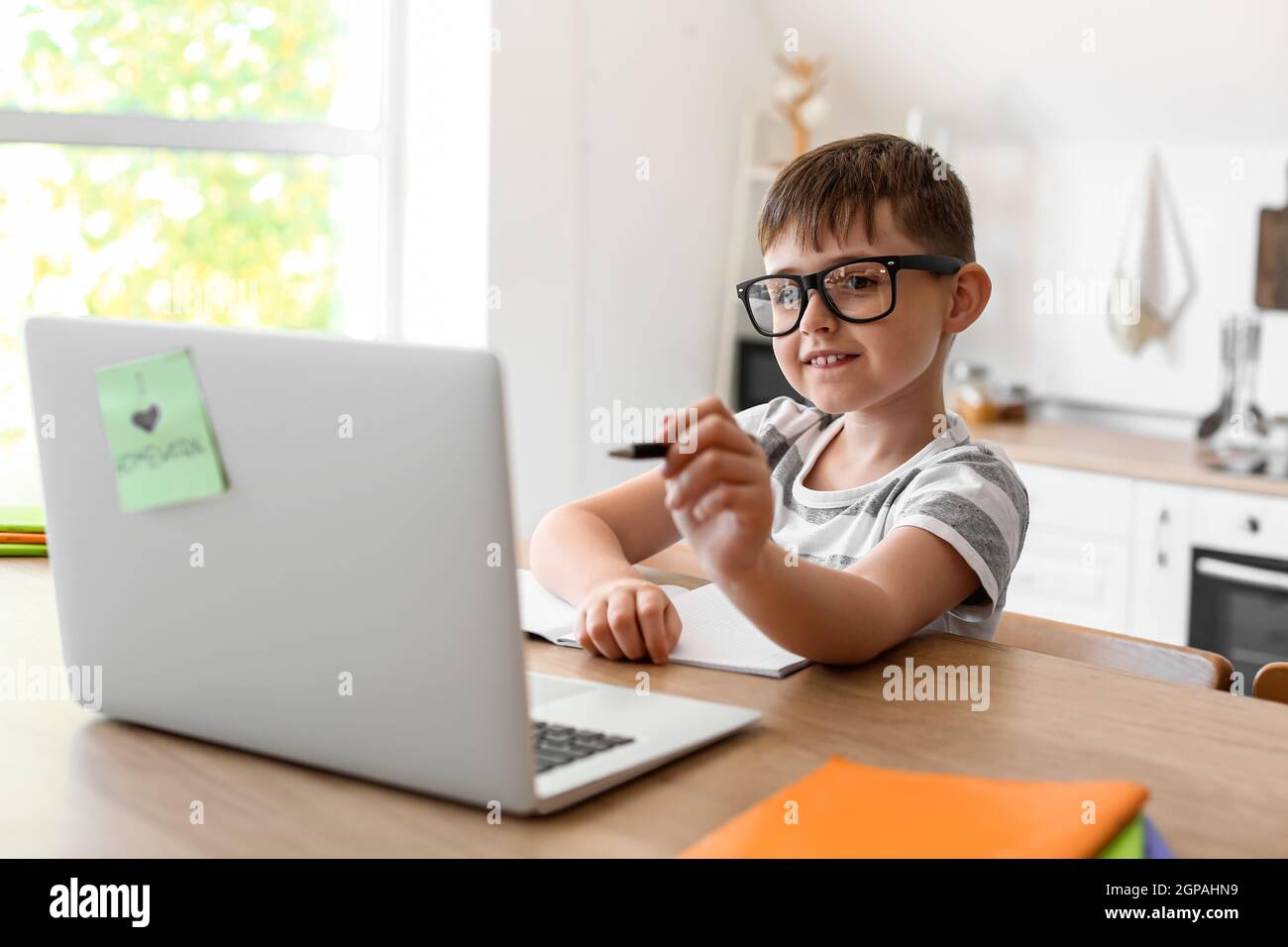 Little boy doing homework in room Stock Photo - Alamy