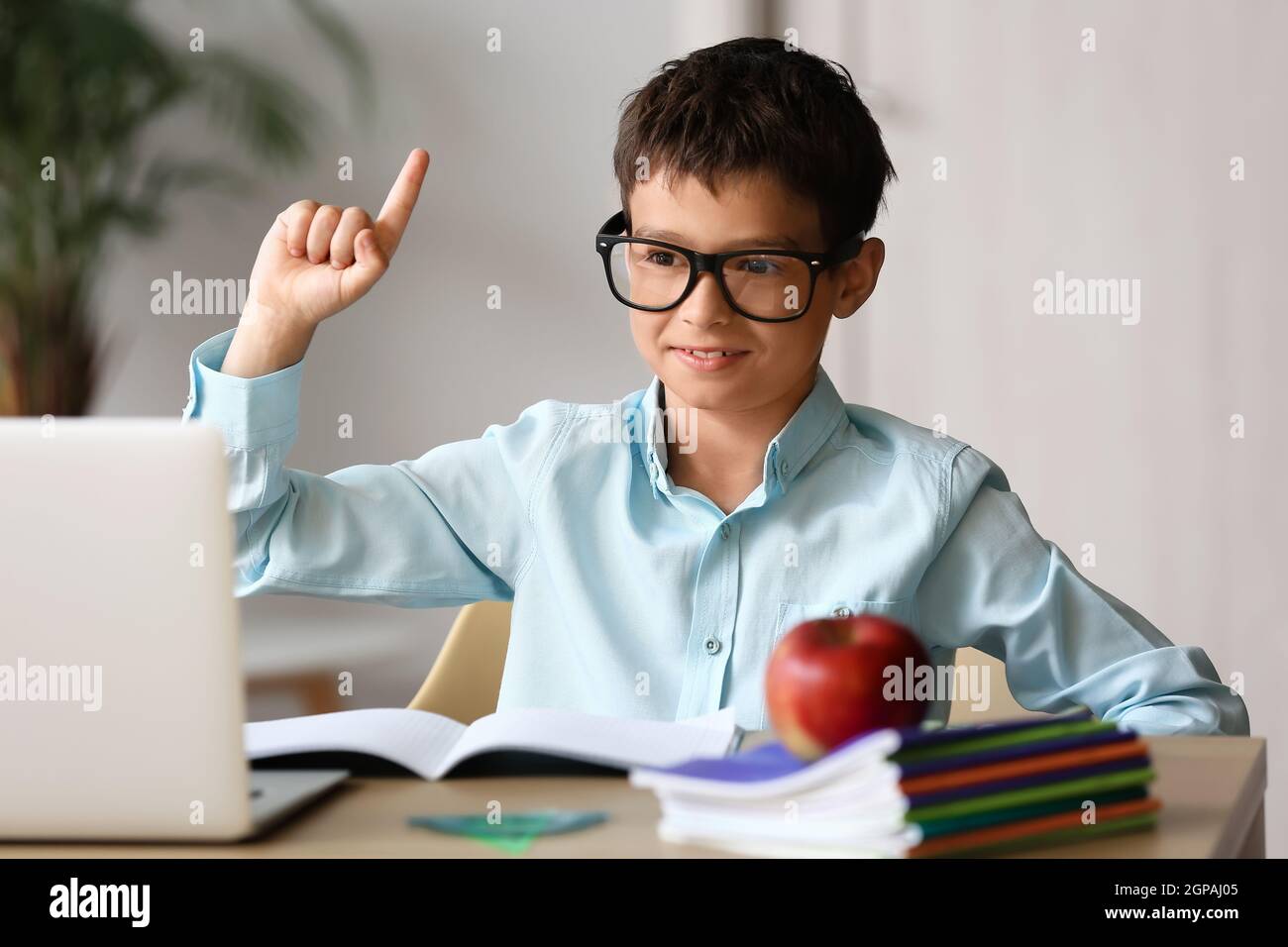 Little boy with raised index finger at home Stock Photo - Alamy