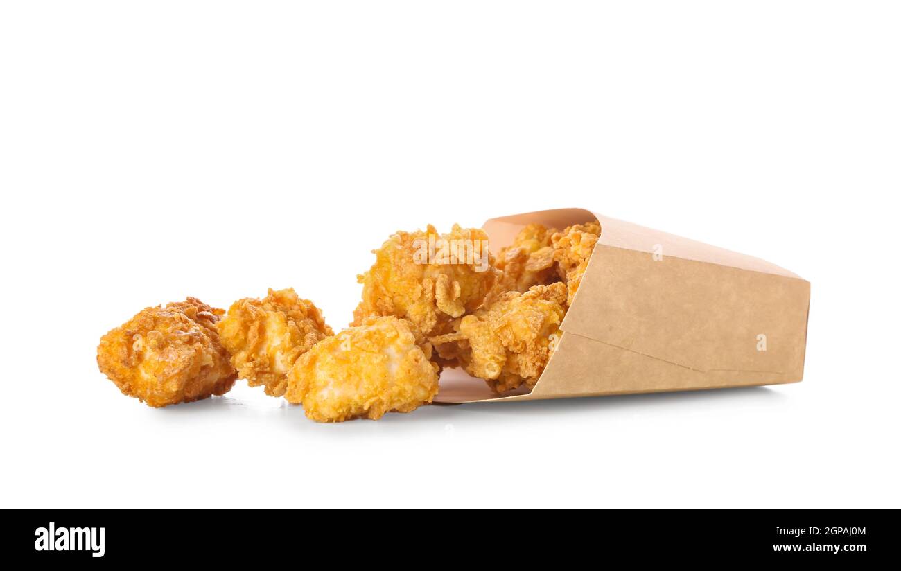 Paper box with crunchy popcorn chicken on white background Stock Photo ...