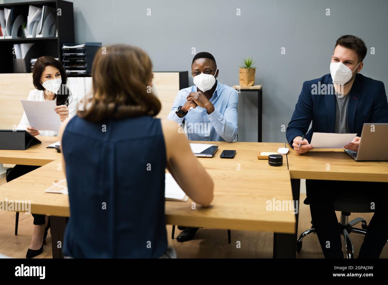 Business Manager Job Interview Talking In Face Mask Stock Photo - Alamy