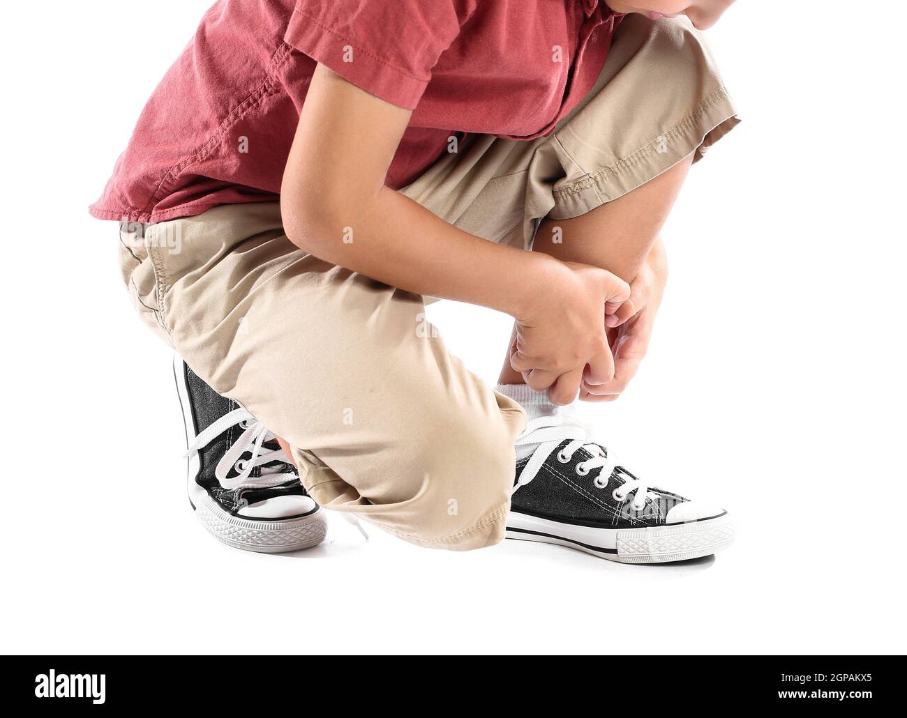 Little boy scratching himself on white background Stock Photo - Alamy