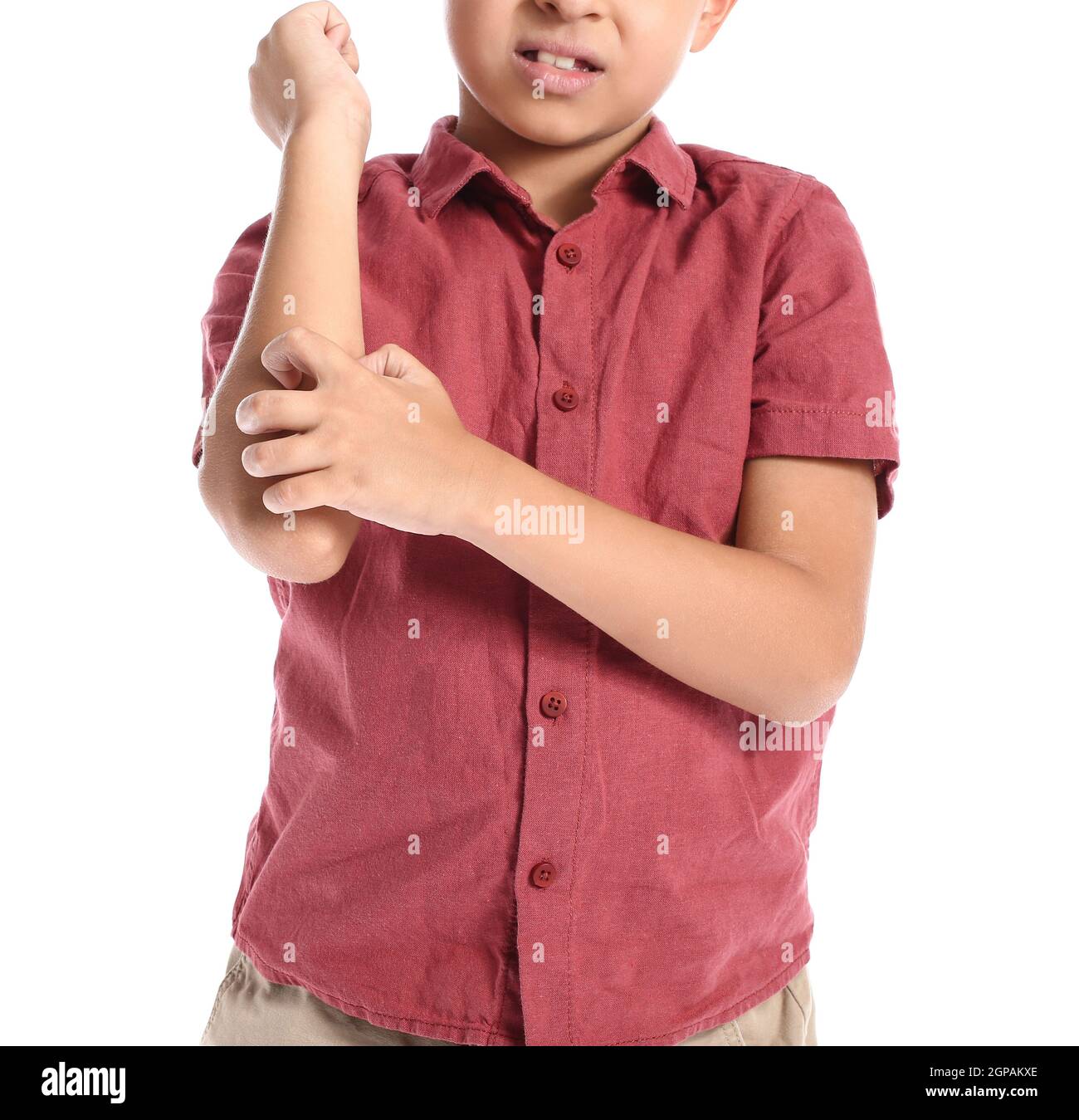 Little boy scratching himself on white background Stock Photo - Alamy