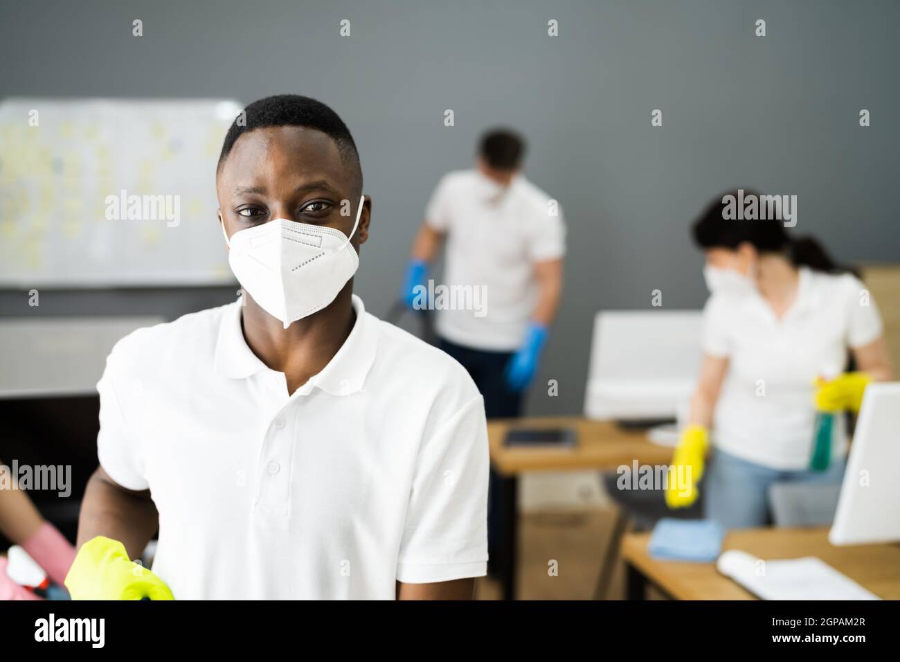 Cleaning Janitor Team Cleaner Group In Face Mask Stock Photo - Alamy