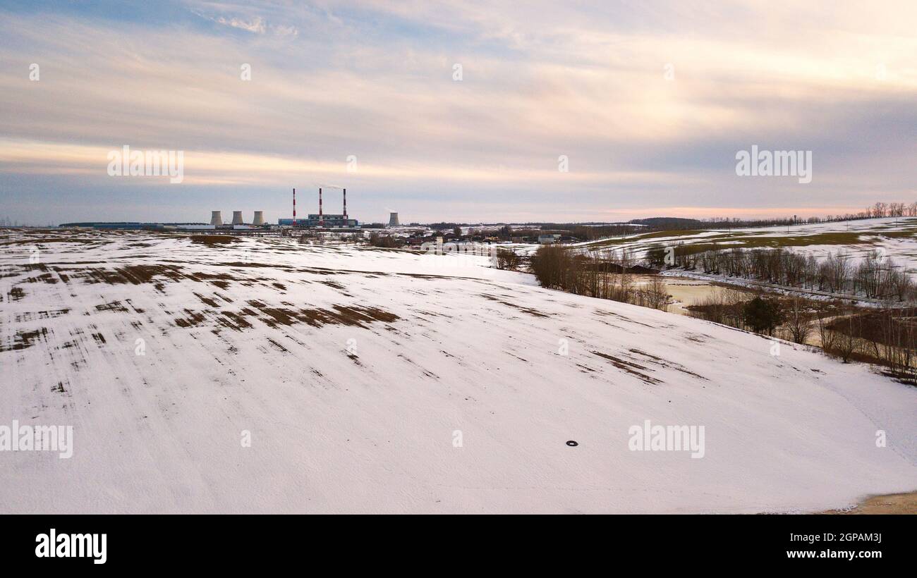 Aerial view of power station in evening light. Early spring urban ...
