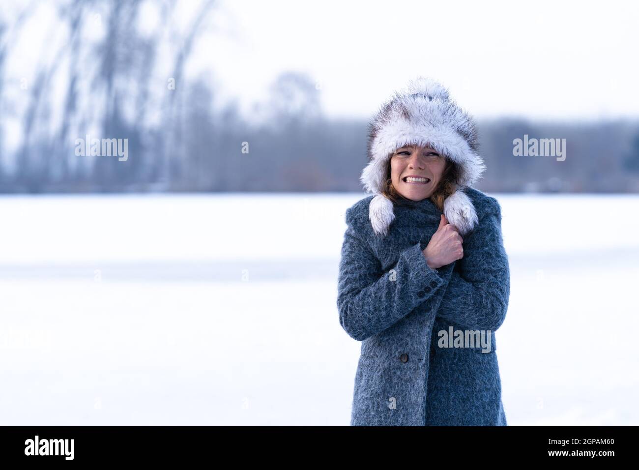 freezing woman on winter icy lake Stock Photo - Alamy