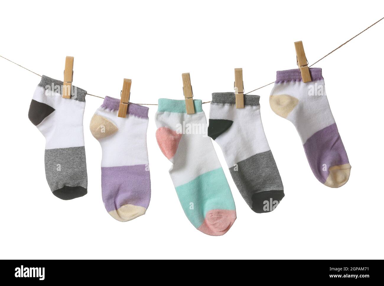 Many different socks hanging on rope against white background Stock ...