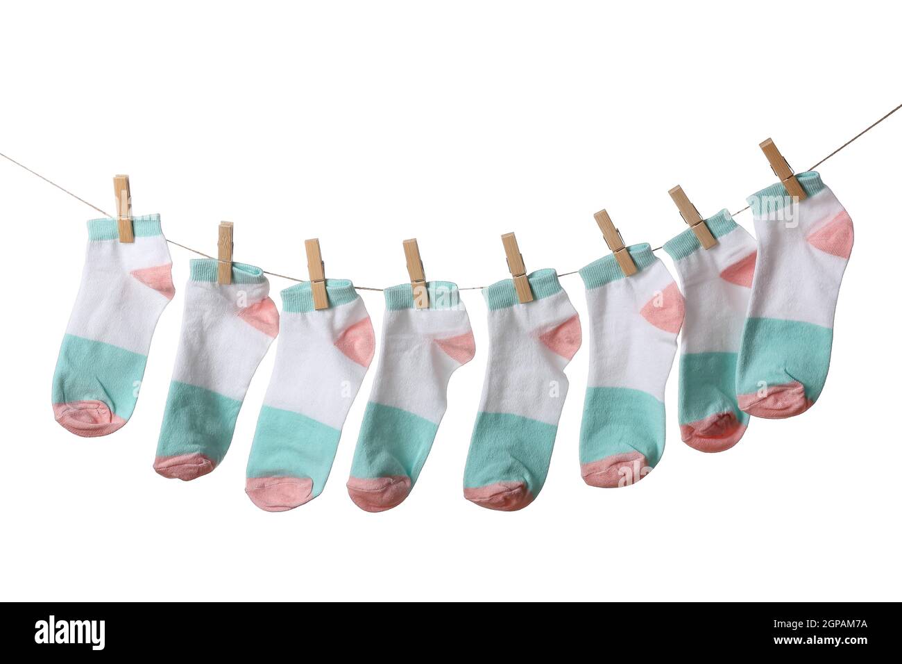Many socks hanging on rope against white background Stock Photo - Alamy