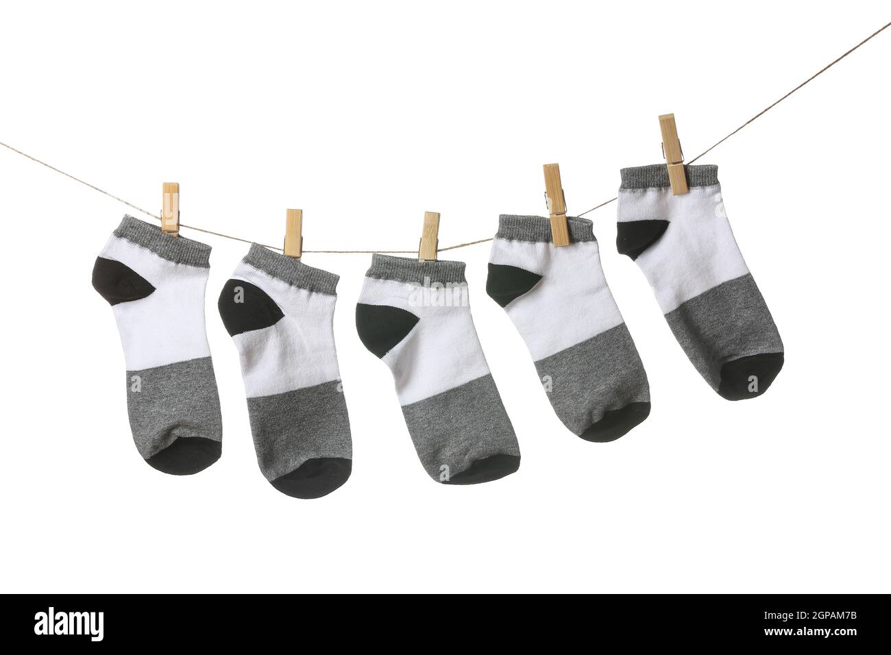 Many socks hanging on clothesline against white background Stock Photo ...