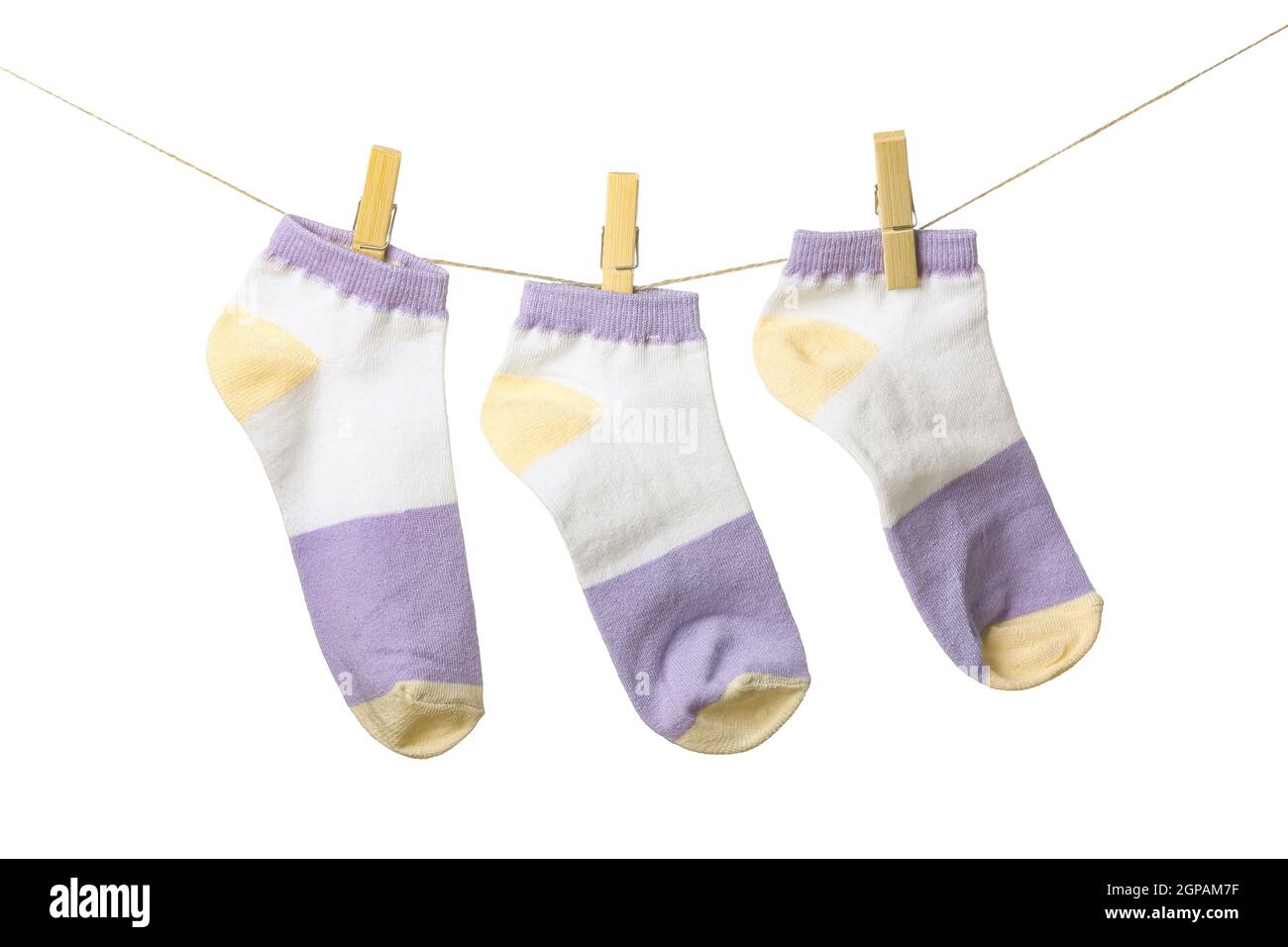 Three socks hanging on rope against white background Stock Photo - Alamy