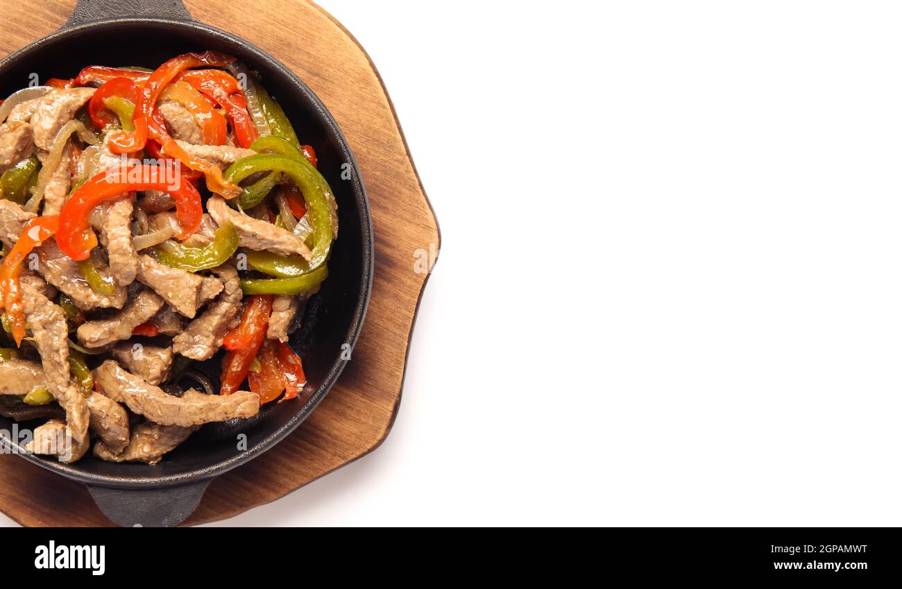 Frying pan with delicious traditional Mexican beef Fajita on white ...