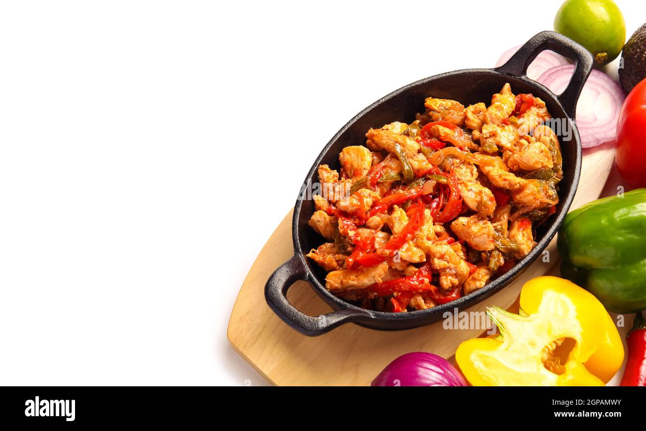 Frying pan with traditional Mexican chicken Fajita and vegetables on ...