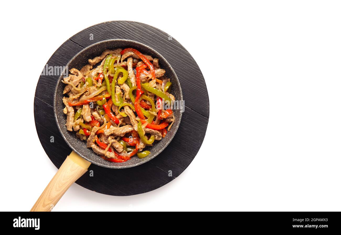 Frying pan with tasty traditional Mexican beef Fajita on white ...