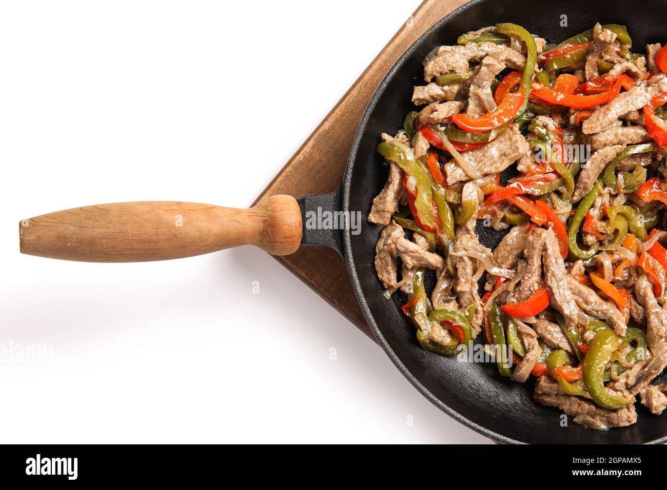 Frying pan with traditional Mexican Fajita and vegetables on white ...