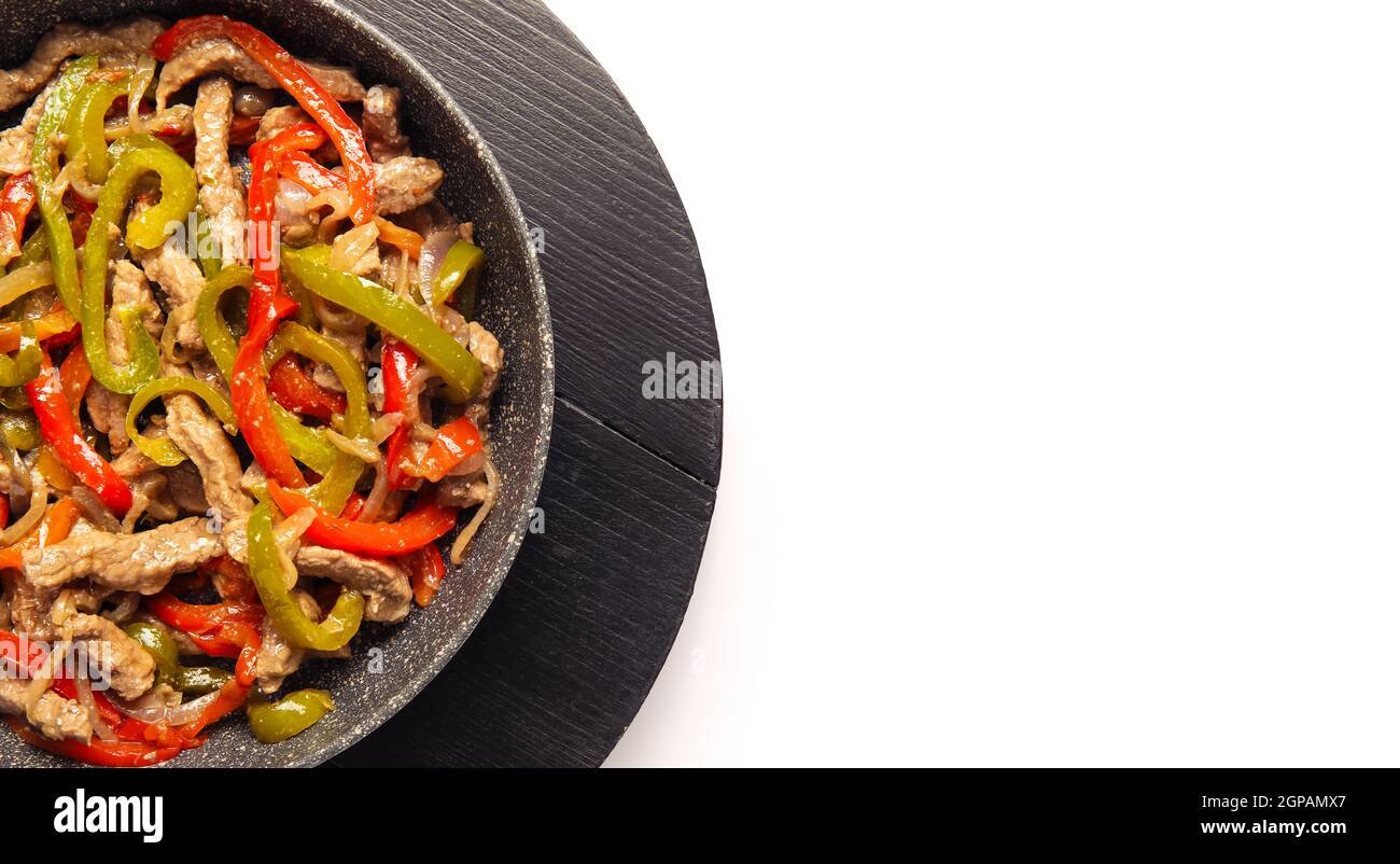 Frying pan with tasty traditional Mexican beef Fajita on white ...