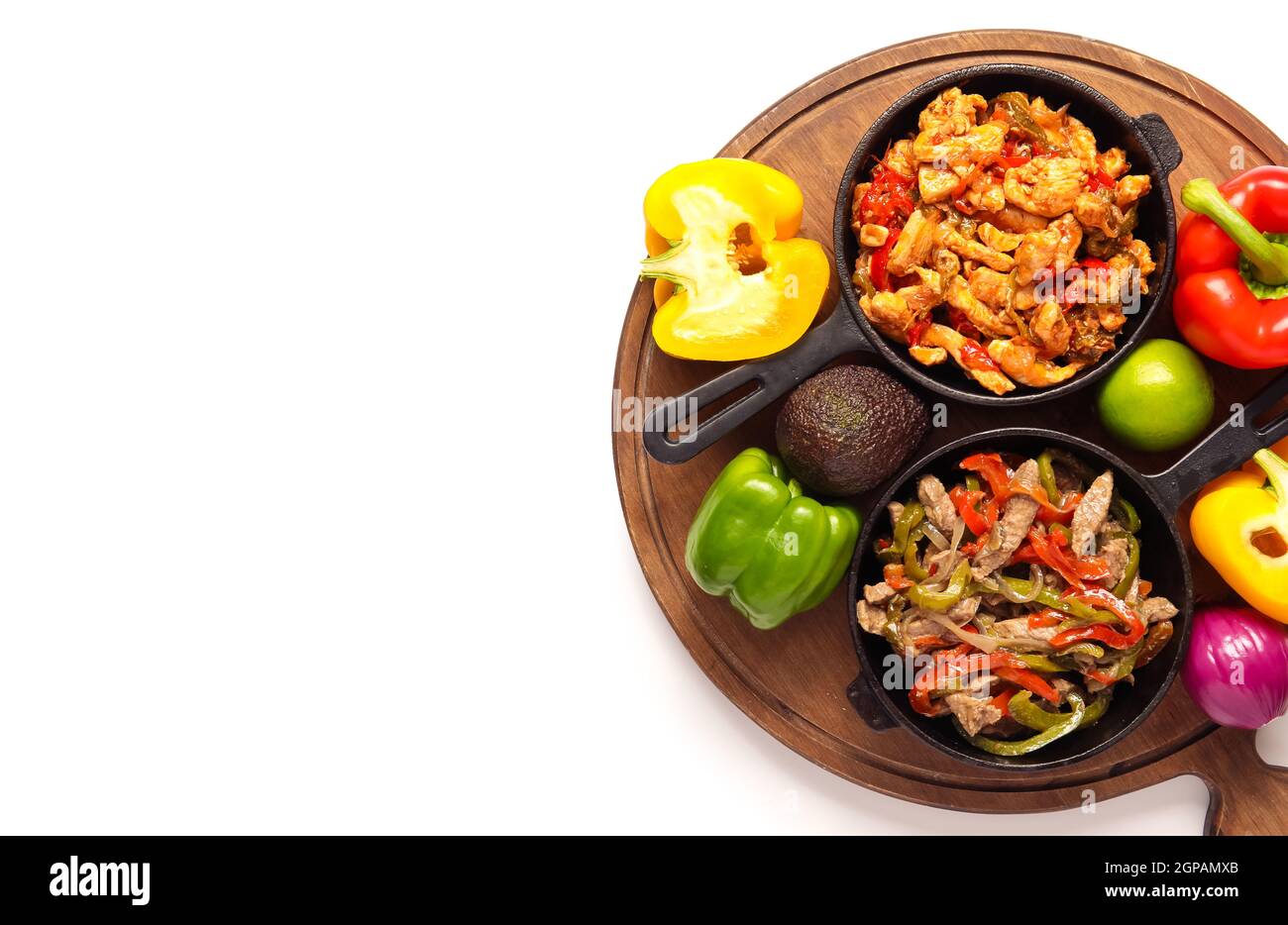 Frying pans with tasty traditional Mexican Fajita on white background ...