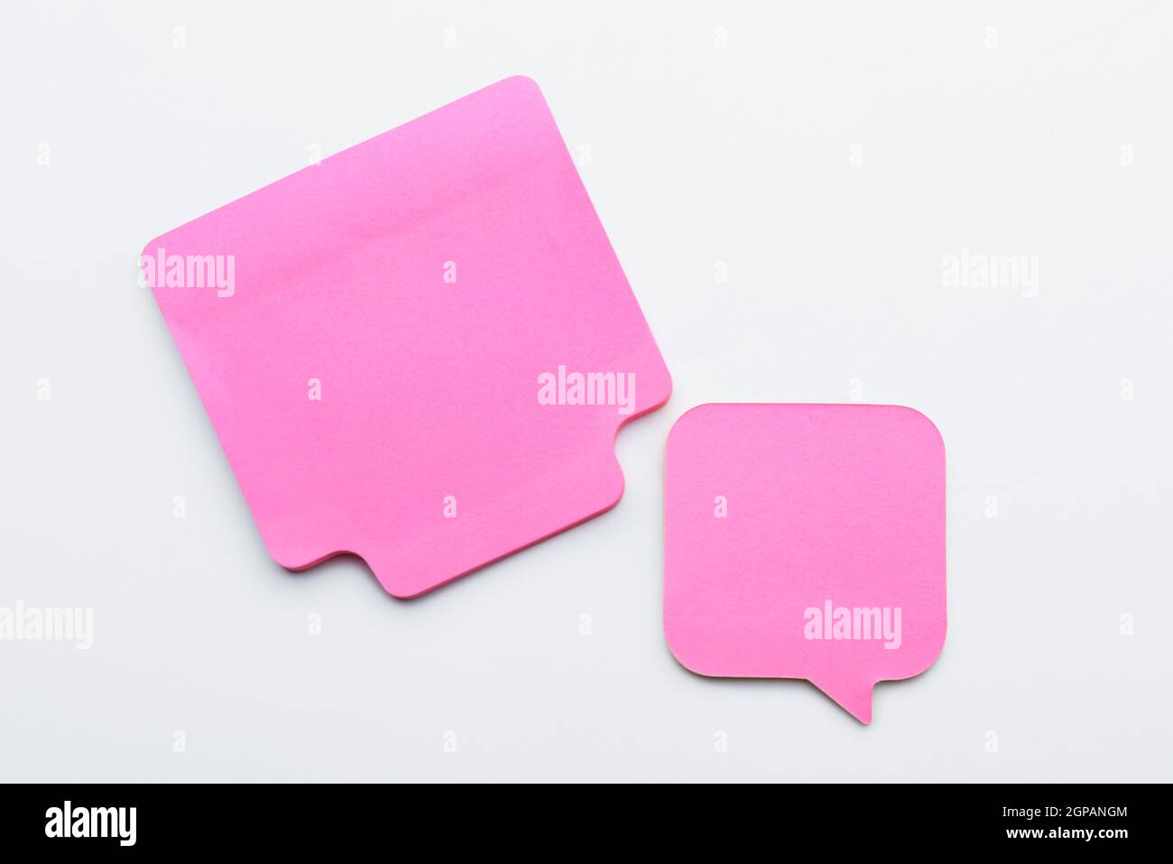 Pink sticky notes on white background Stock Photo - Alamy