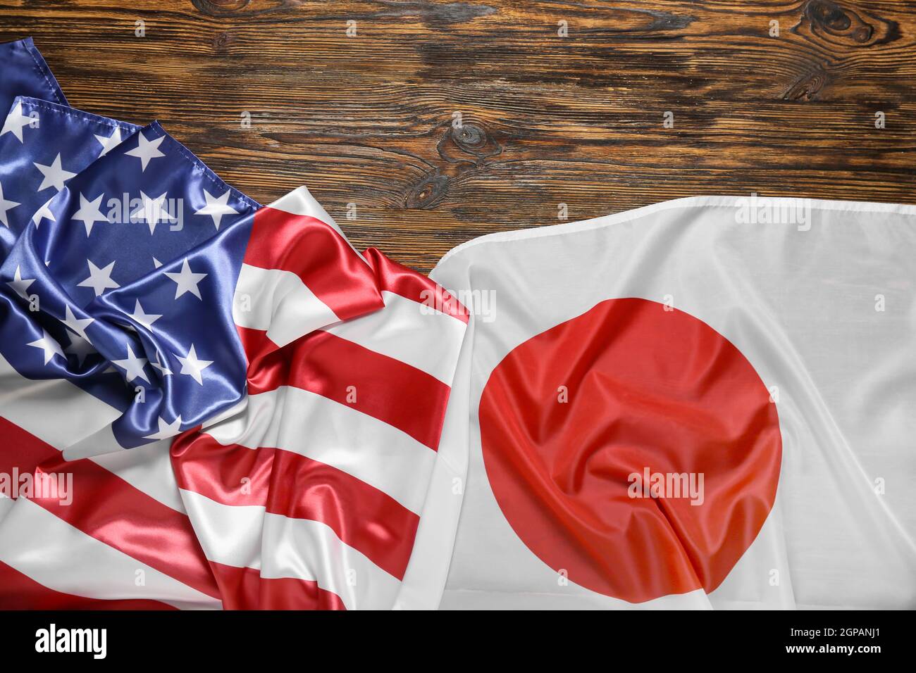 Flags of Japan and USA on wooden background Stock Photo - Alamy
