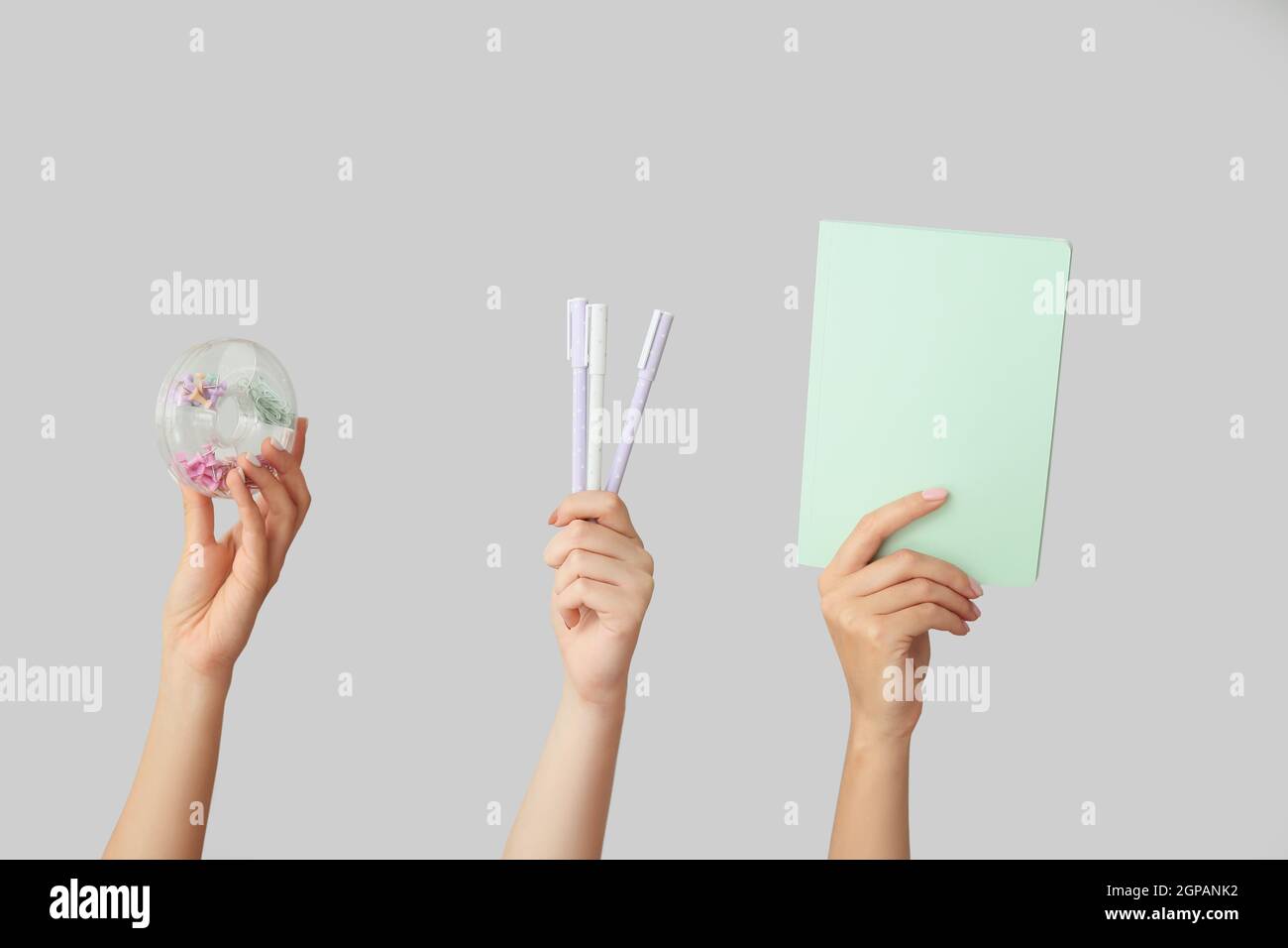 Many different hands with school supplies on grey background Stock ...