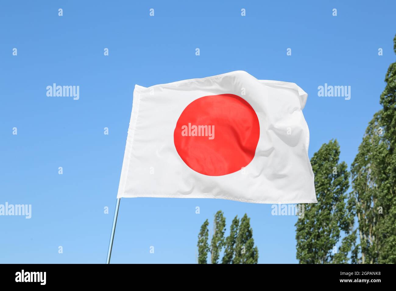 Waving flag of Japan outdoors Stock Photo - Alamy