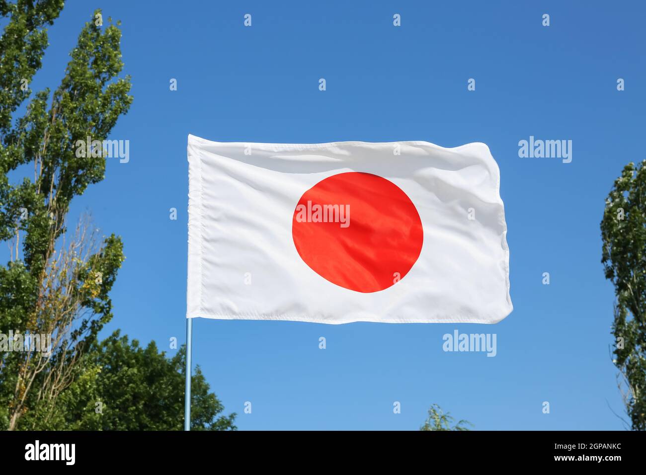 Waving flag of Japan outdoors Stock Photo - Alamy
