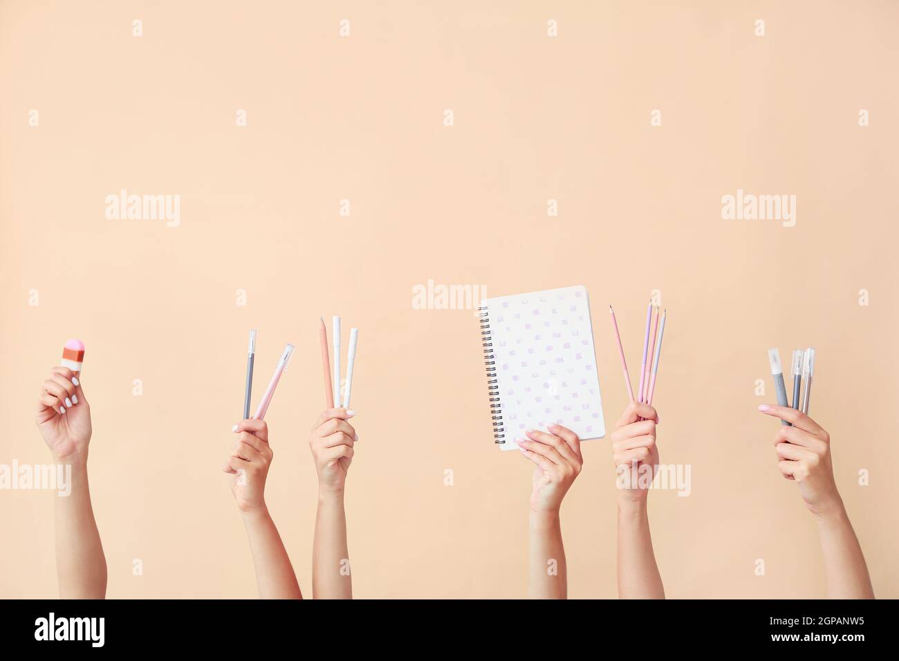 Many different hands with school supplies on color background Stock ...