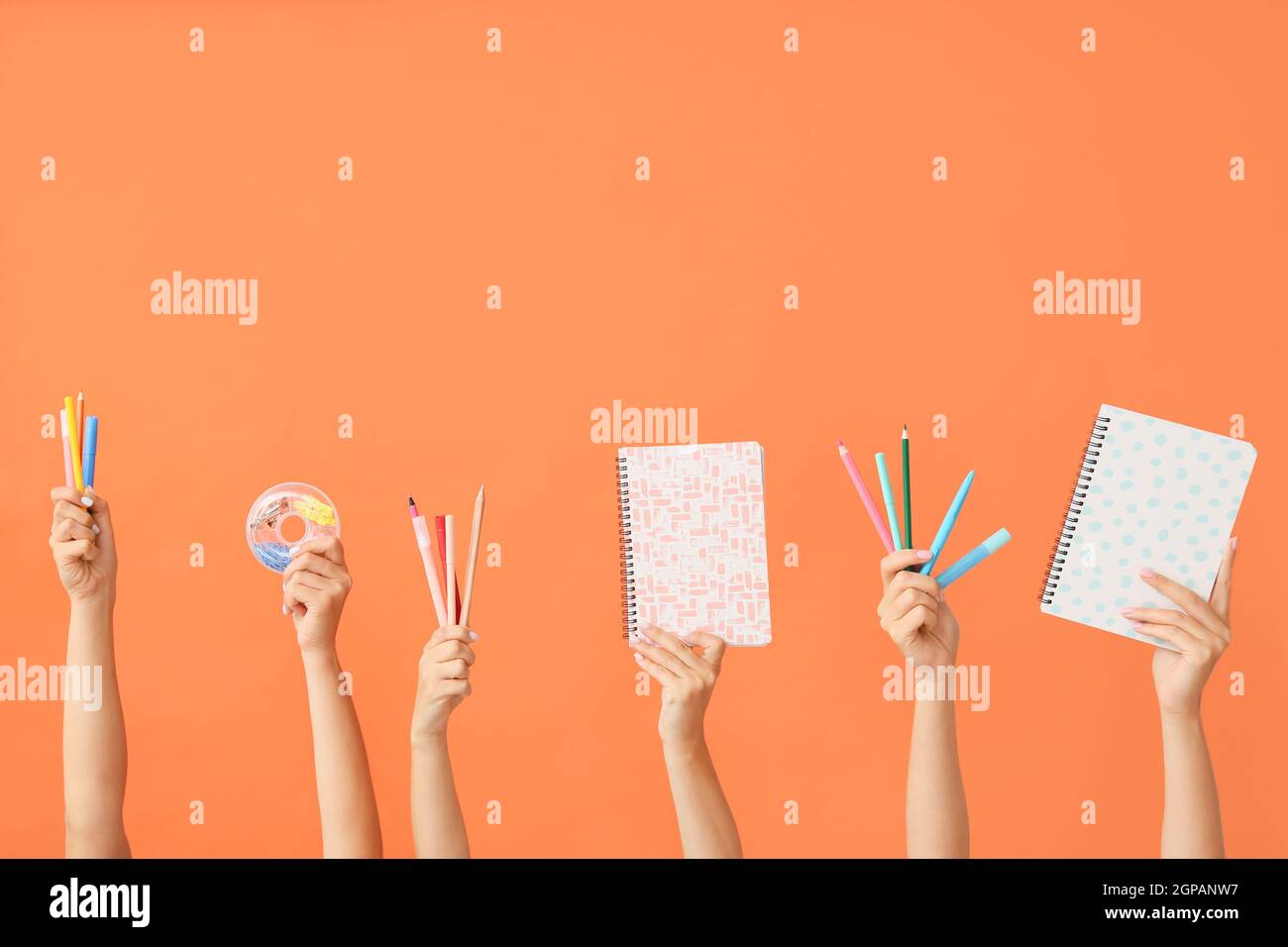 Many different hands with school supplies on color background Stock ...