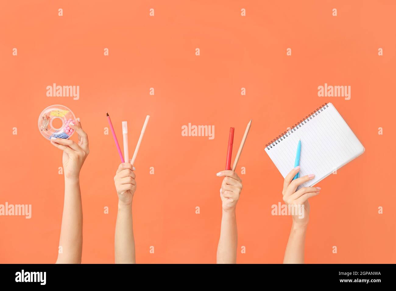Many different hands with school supplies on color background Stock ...