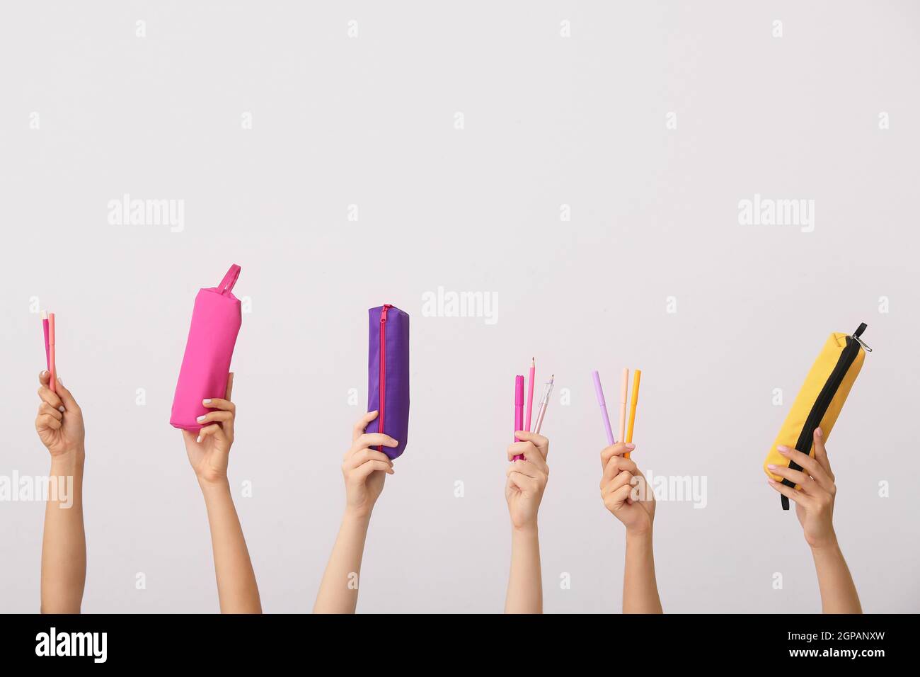 Many different hands with school supplies on grey background Stock ...