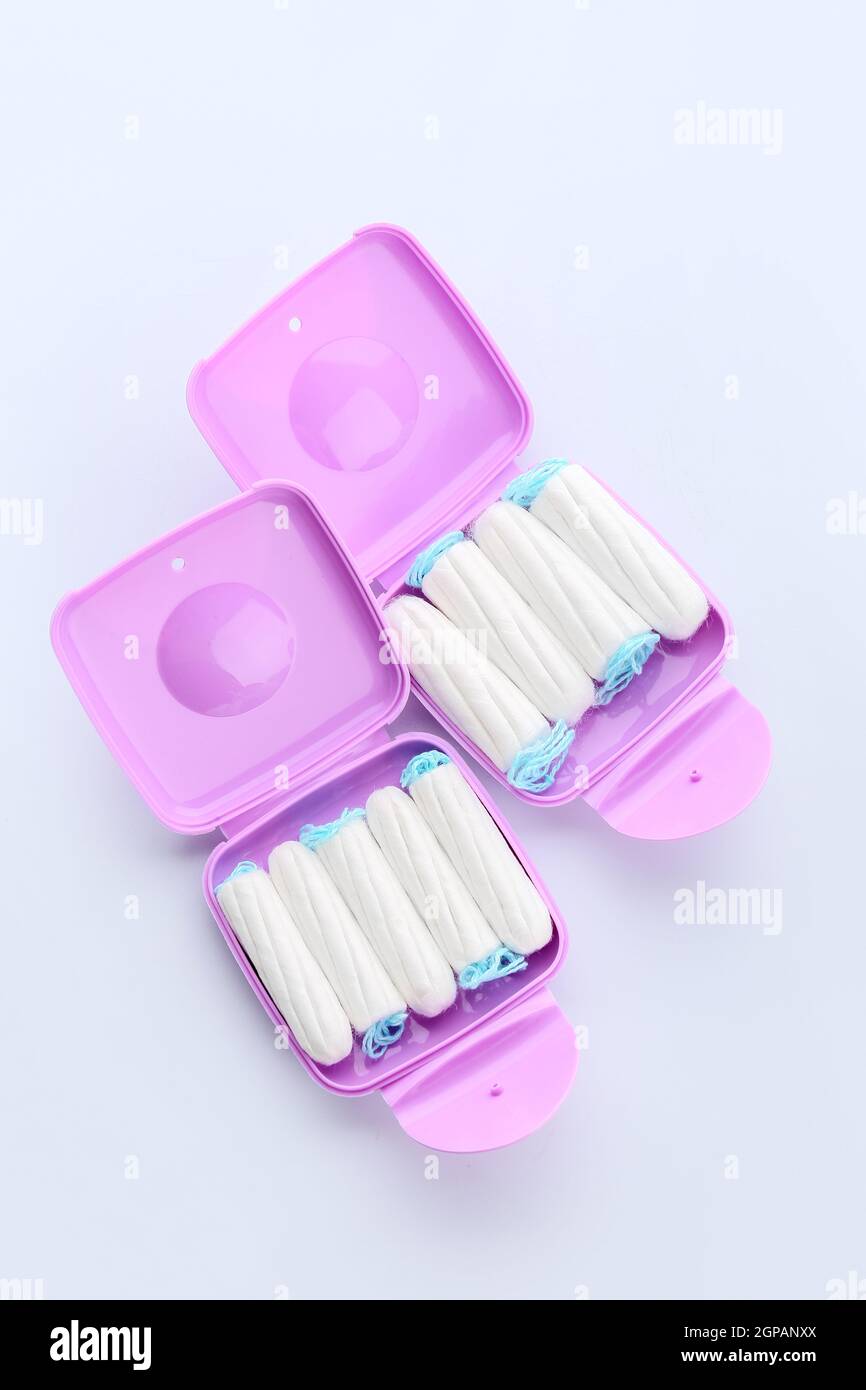 Tampons storage box on light grey background Stock Photo - Alamy