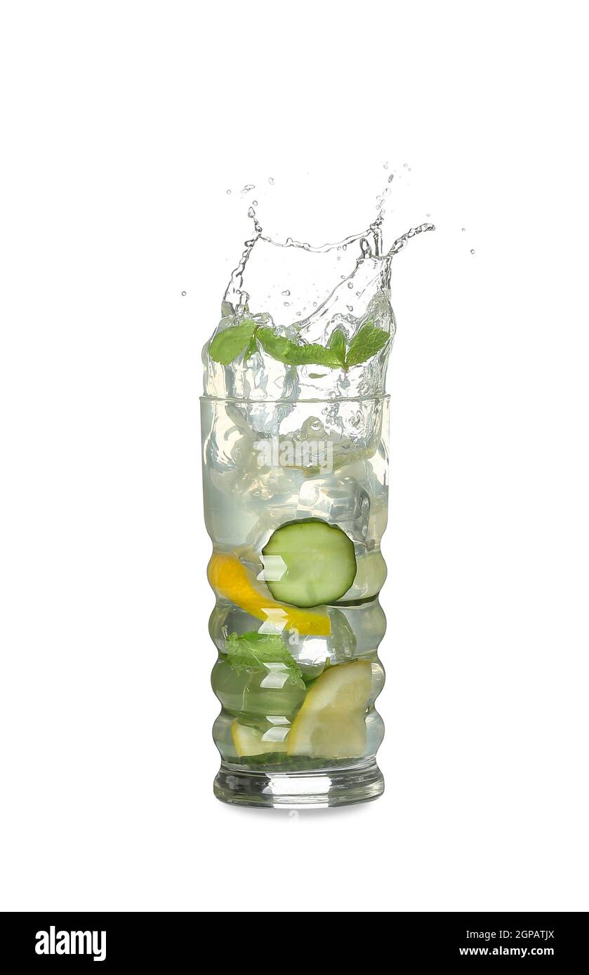 Glass of splashing lemonade on white background Stock Photo - Alamy