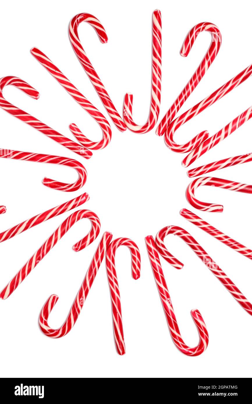 Frame made of candy canes on white background Stock Photo - Alamy