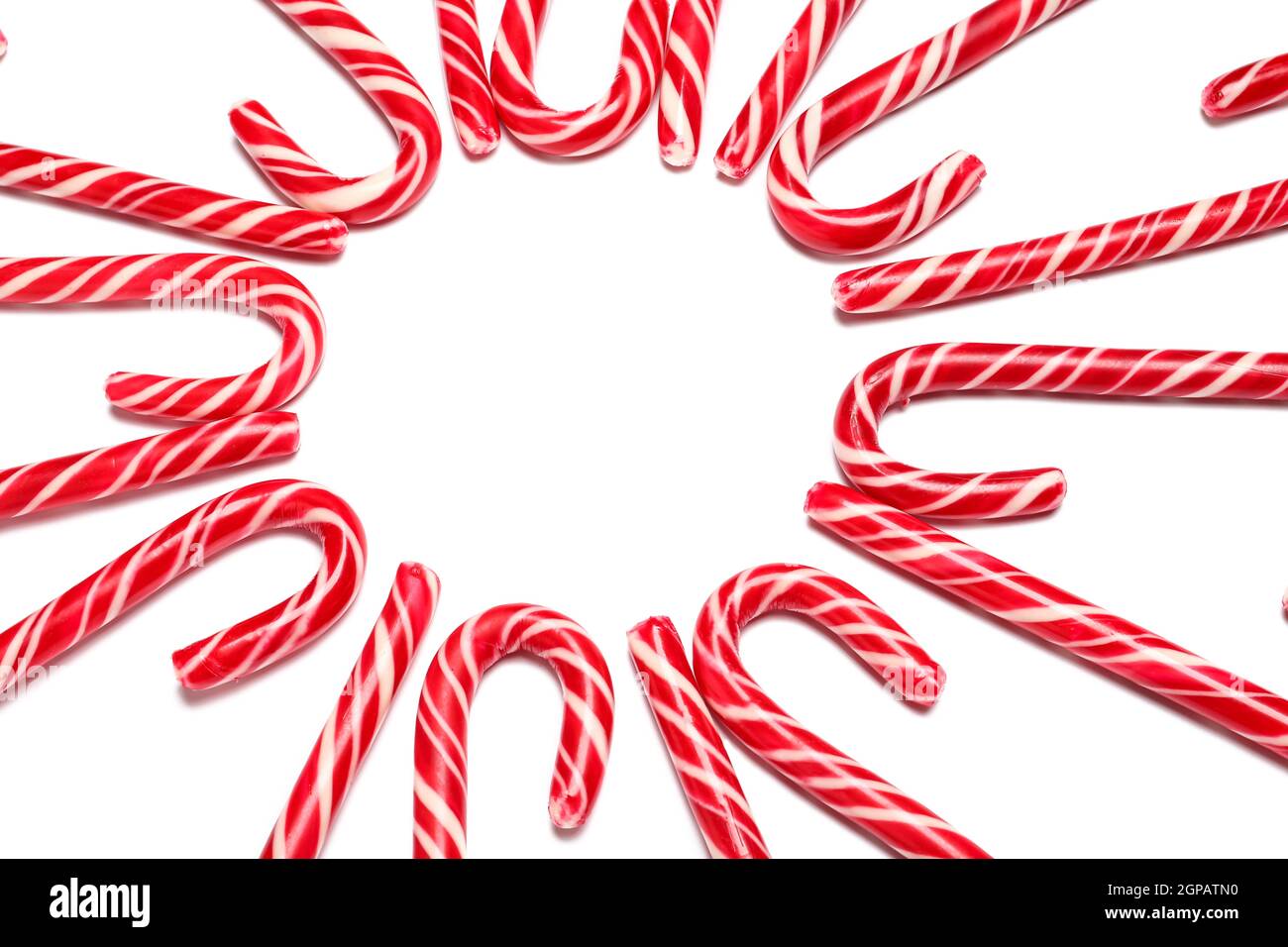 Frame made of candy canes on white background Stock Photo - Alamy