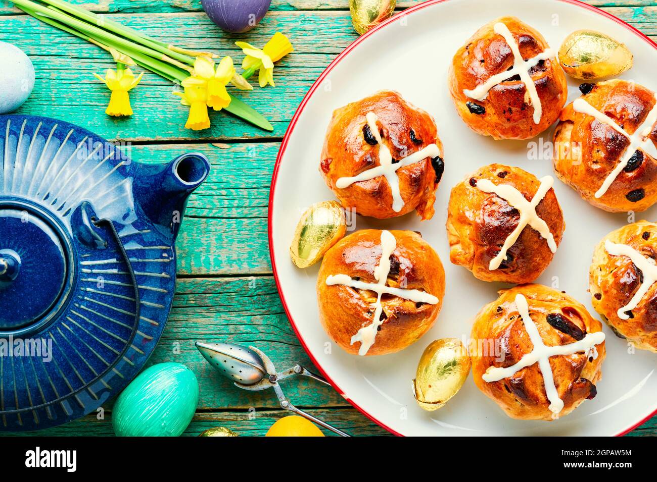 Easter hot cross buns and holiday decor.Traditional English Easter buns ...