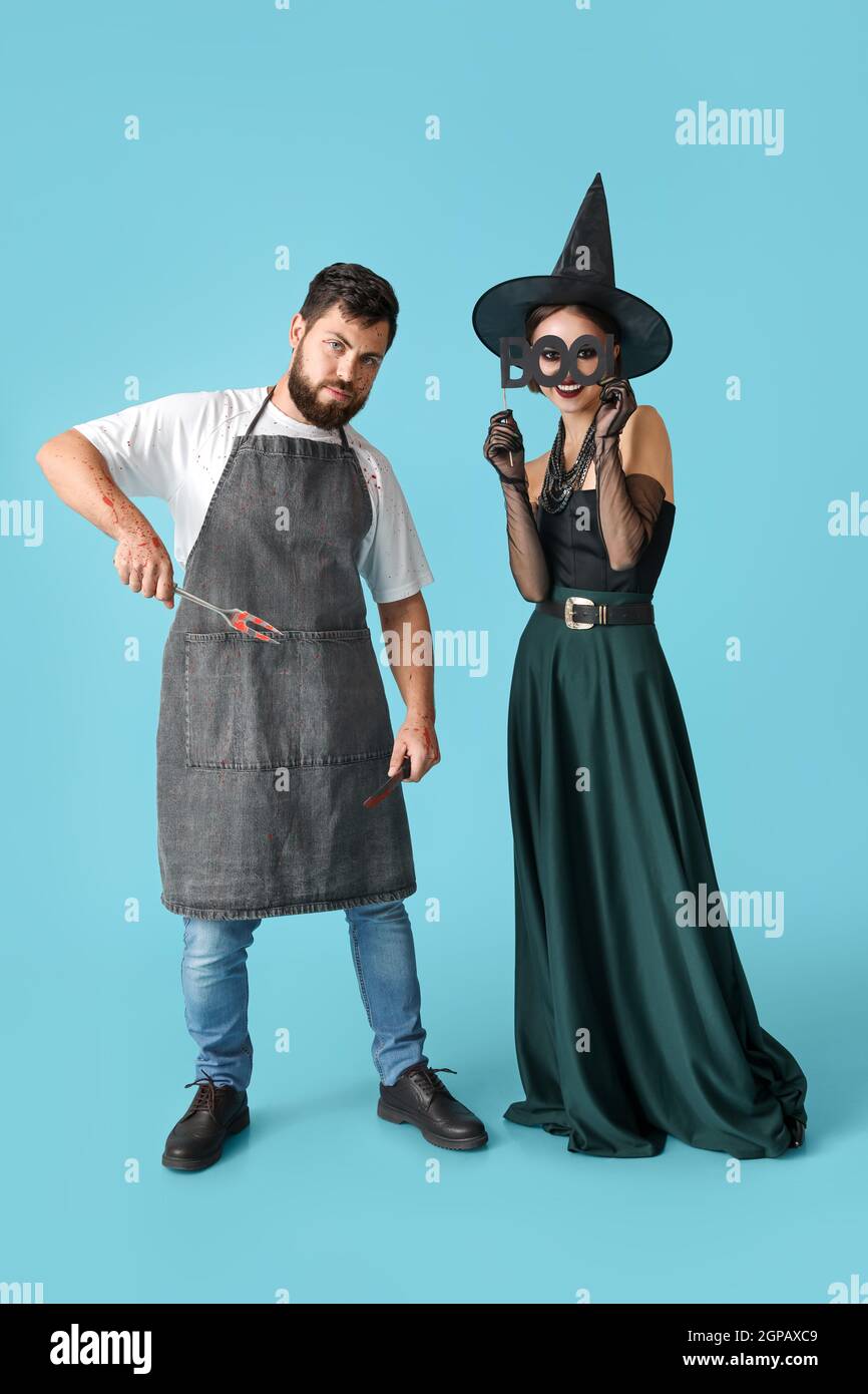People in Halloween costumes on color background Stock Photo - Alamy