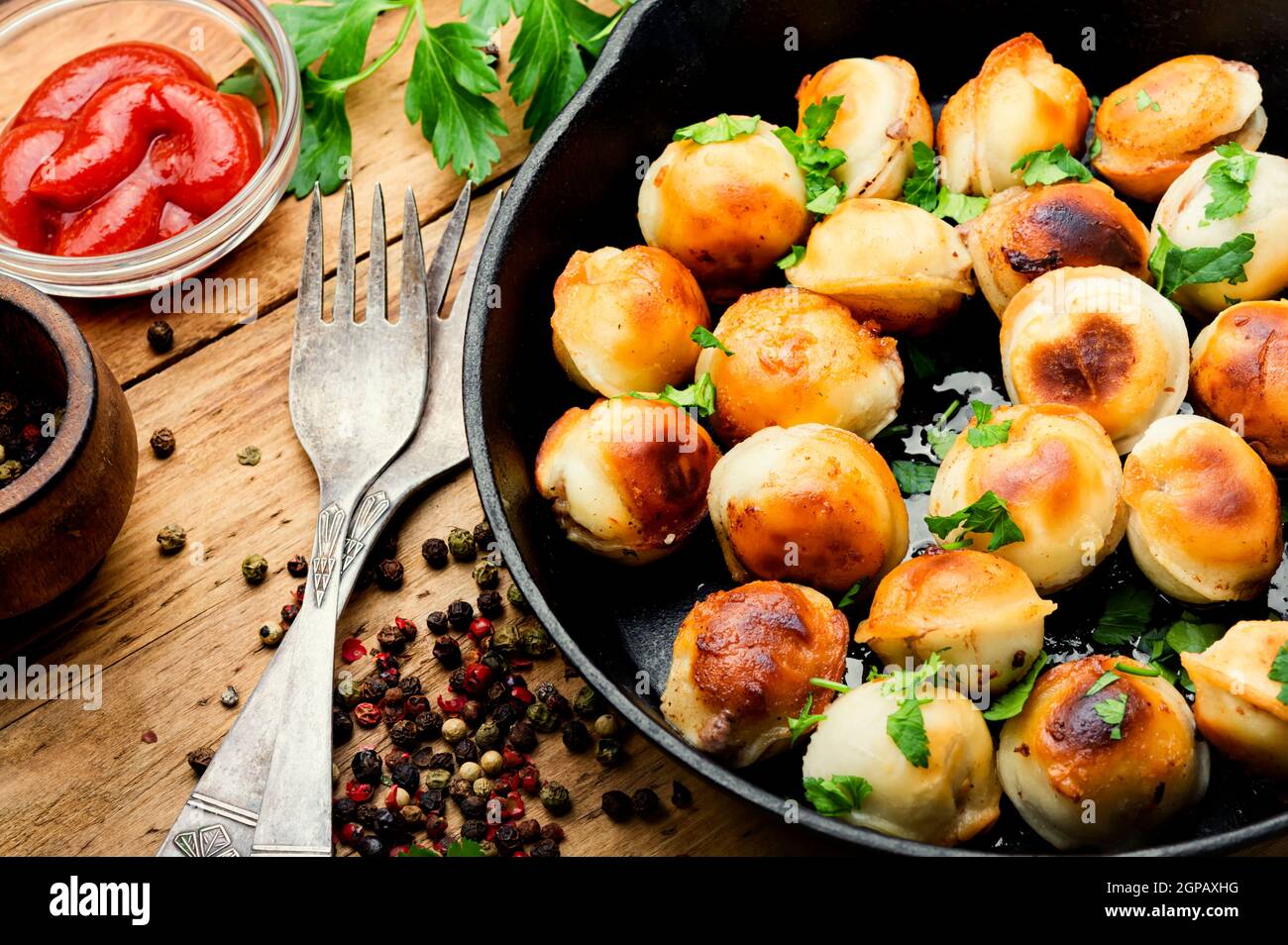Frying pan with roasted tasty pelmeni.Fried dumplings Stock Photo - Alamy
