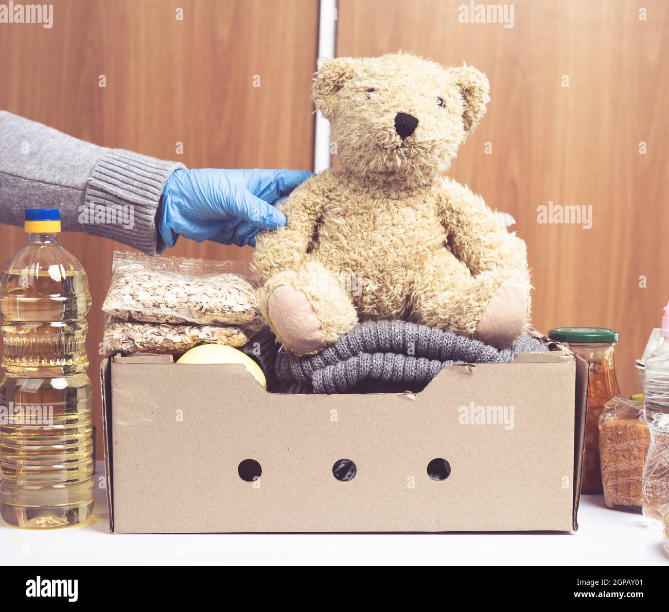 cardboard box with food and things to help those in need, help concept ...