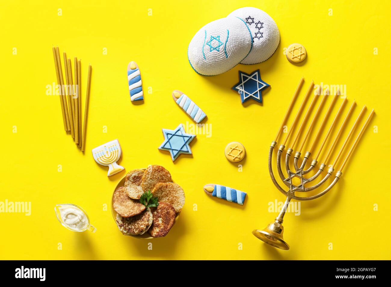 Different symbols of Hanukkah on color background Stock Photo - Alamy