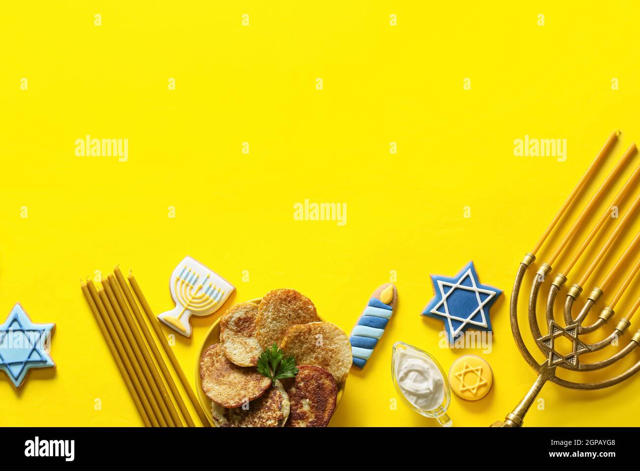 Different symbols of Hanukkah on color background Stock Photo - Alamy