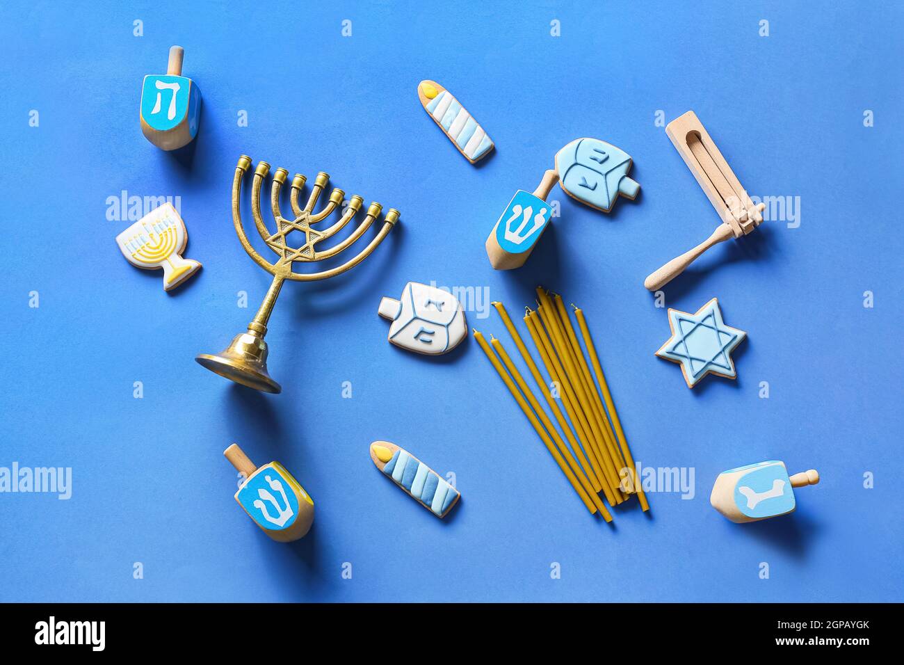 Different symbols of Hanukkah on color background Stock Photo - Alamy