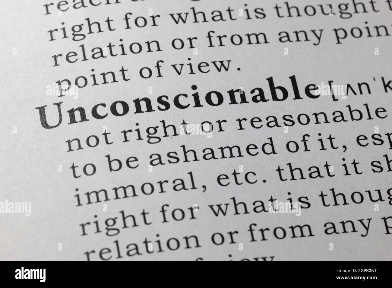 Fake Dictionary, Dictionary definition of Unconscionable Stock Photo ...