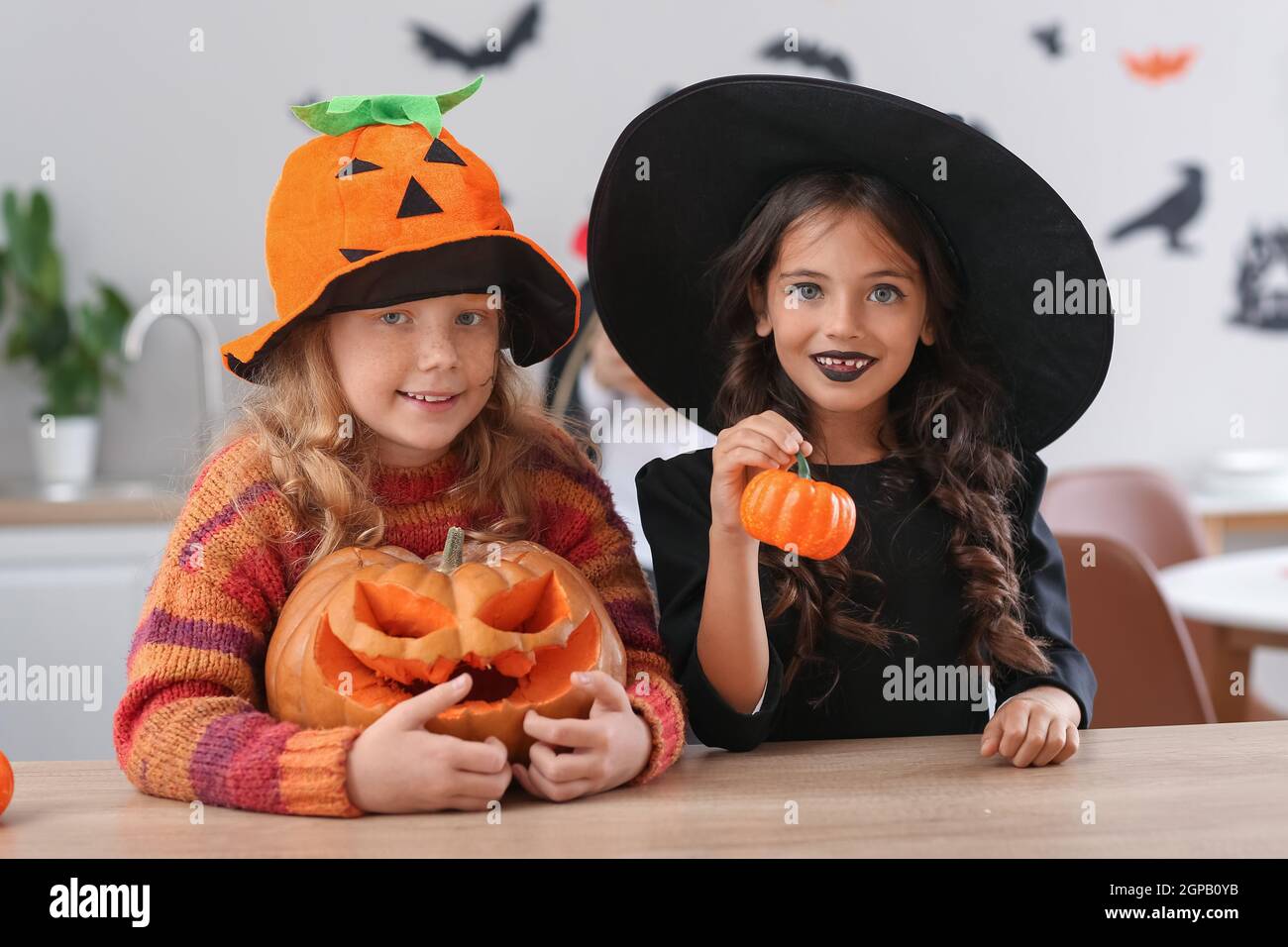 Cute little children celebrating Halloween at home Stock Photo - Alamy