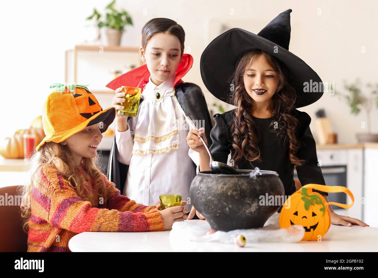 Cute little children celebrating Halloween at home Stock Photo - Alamy