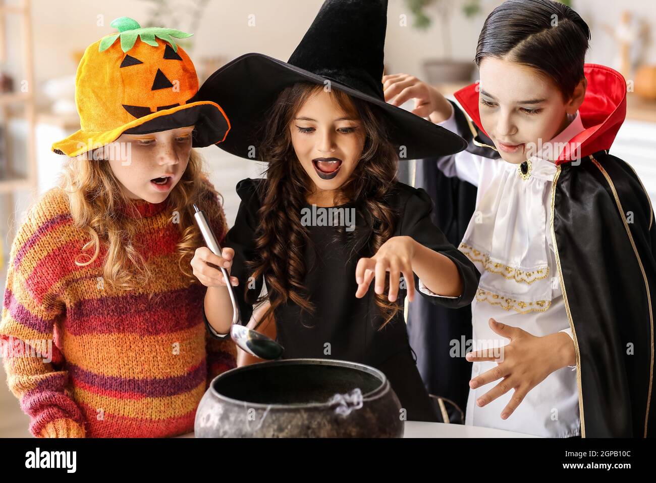 Cute little children celebrating Halloween at home Stock Photo - Alamy