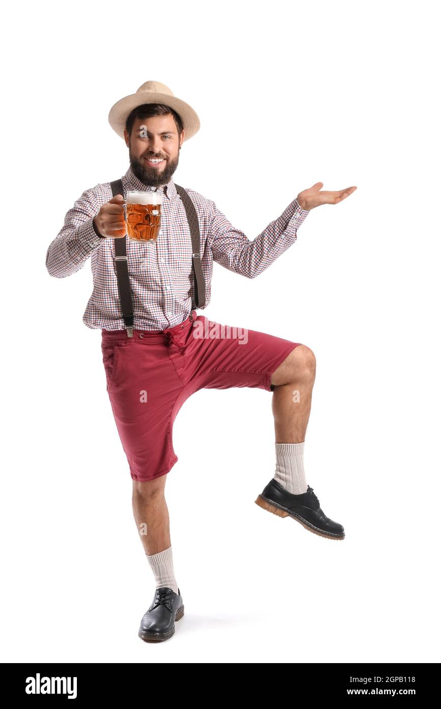 Handsome man in traditional German clothes and with beer on white ...