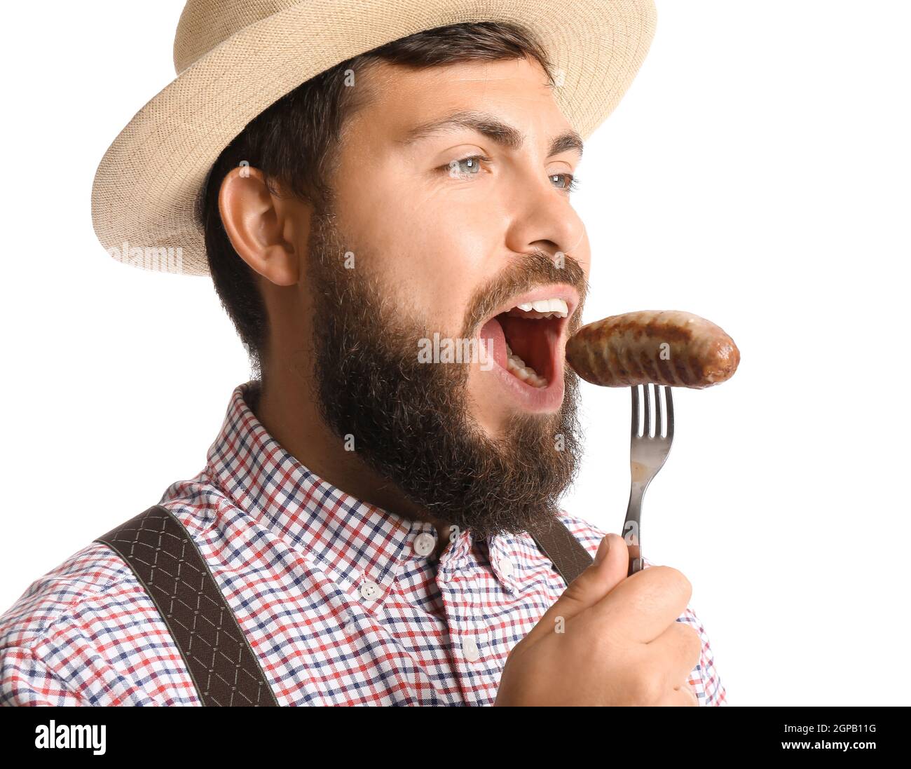 Handsome man in traditional German clothes and with sausage on white ...