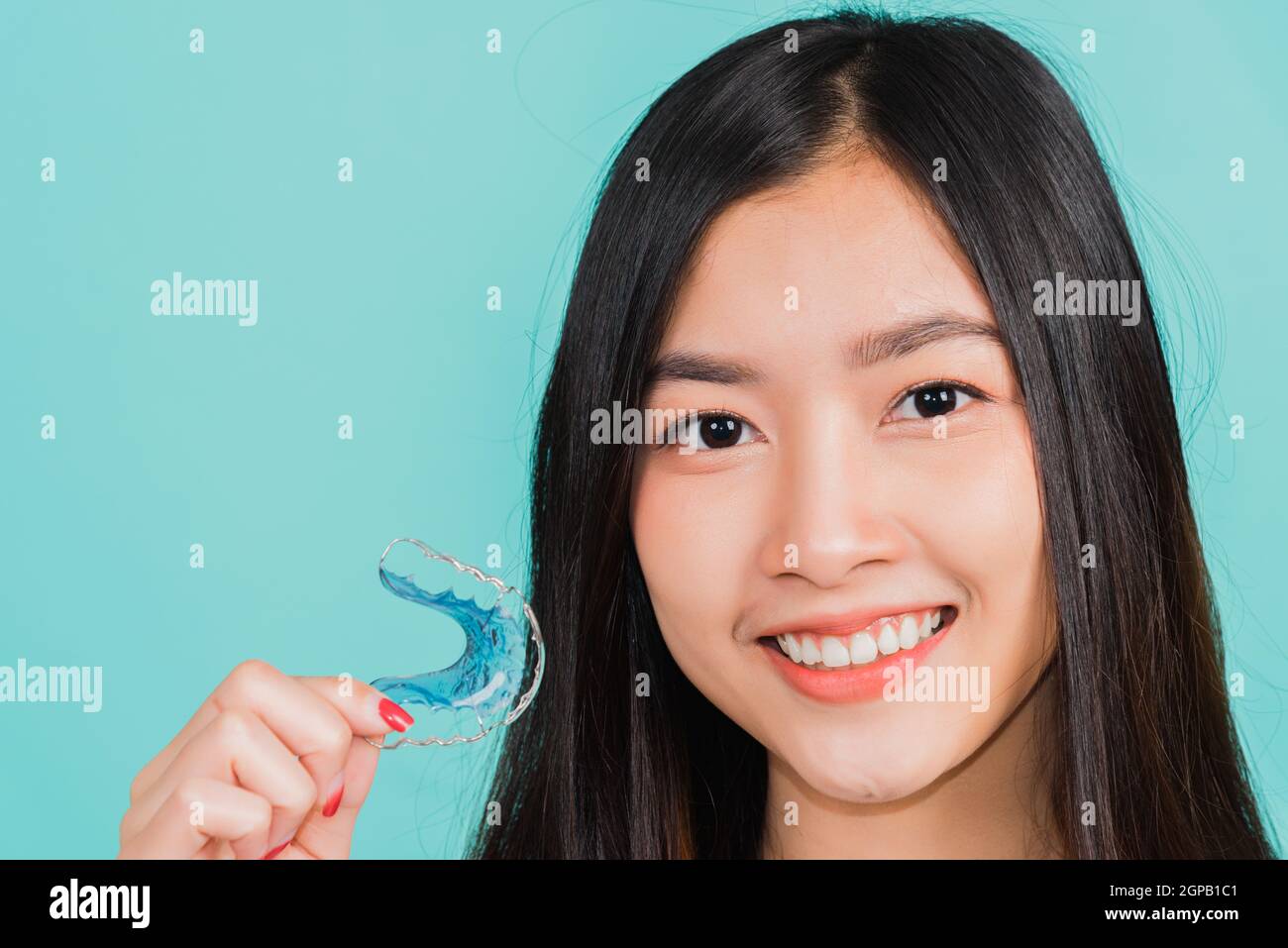 Portrait young Asian beautiful woman smiling holding silicone ...
