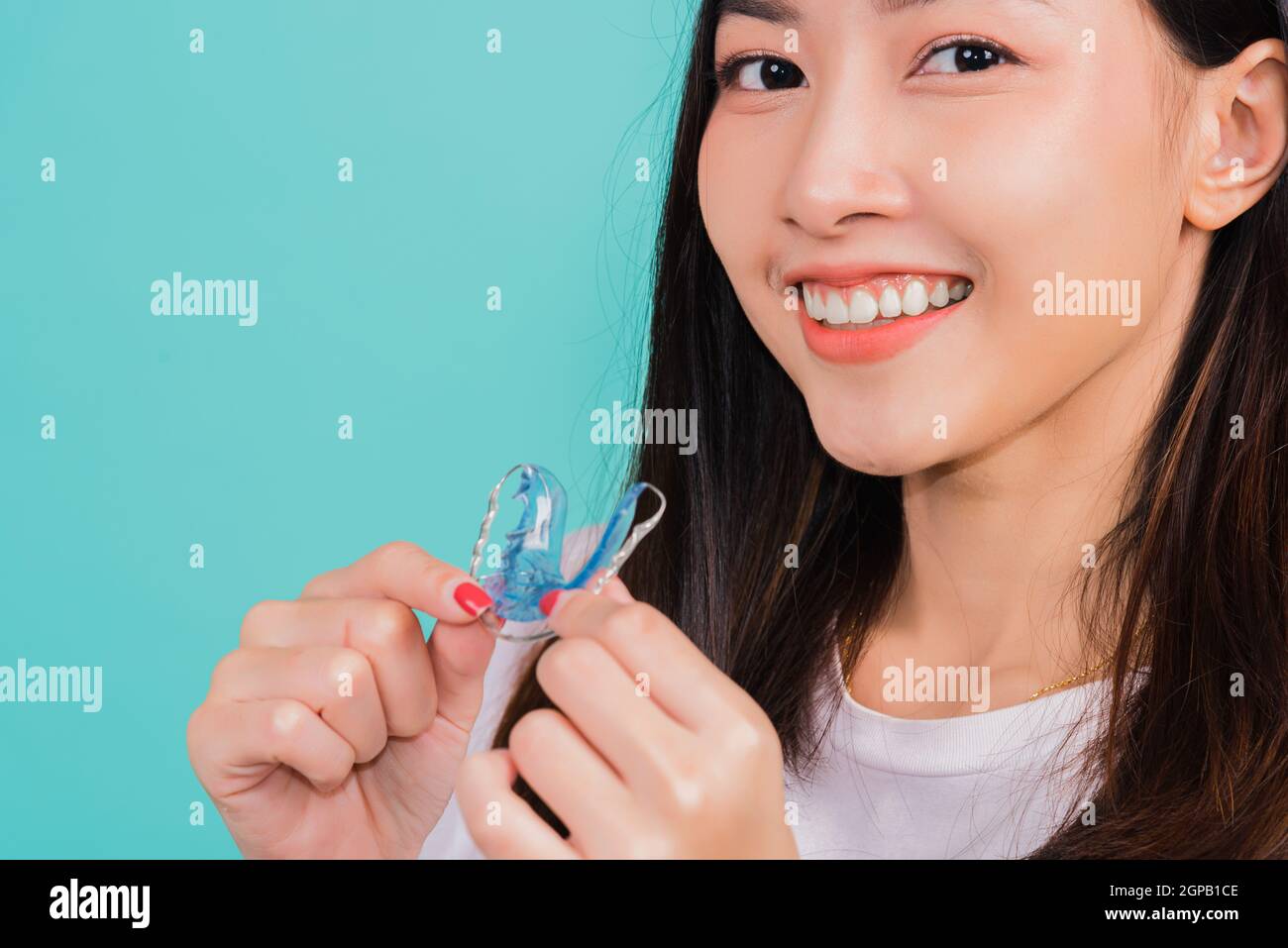 Teeth retaining tools after removable braces, Portrait young Asian ...